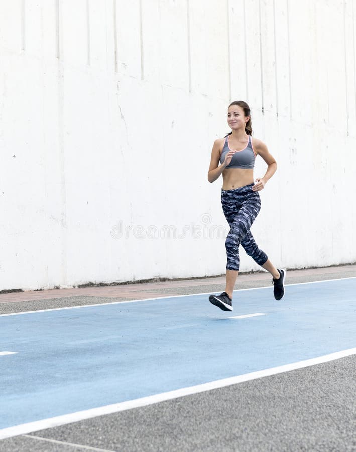 White Woman Running on Track Stock Image - Image of energy, sport ...