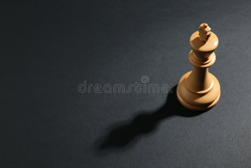 White Wooden Chess King on Dark Background, Above View. Space for Text ...