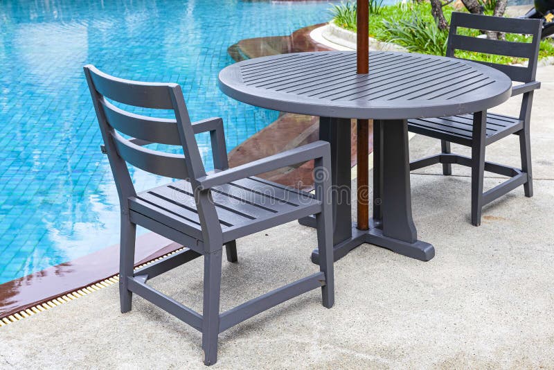 Wooden Dining Table by the Pool Inside the Resort Stock Photo - Image ...