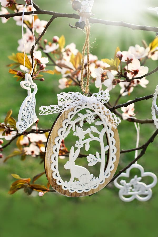 Easter Decorations Hanging on Trees in Spring Blooming Garden Stock ...