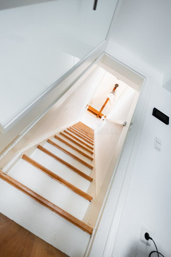 White and Wooden Staircase Corridor in Dutch Angle Stock Image - Image ...