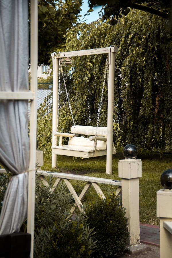 White Wooden Swing in the Garden. Romantic Place Stock Image - Image of ...