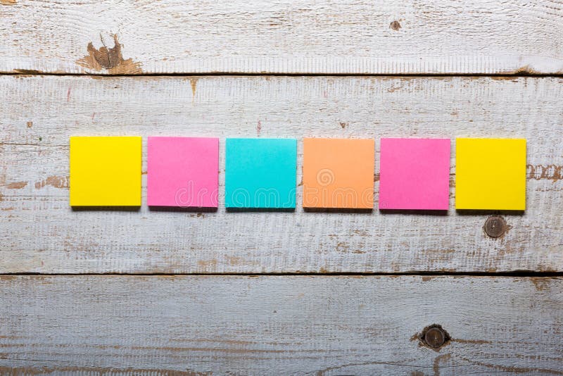White Wooden Table with Empty Colorful Sticky Notes Stock Photo - Image ...