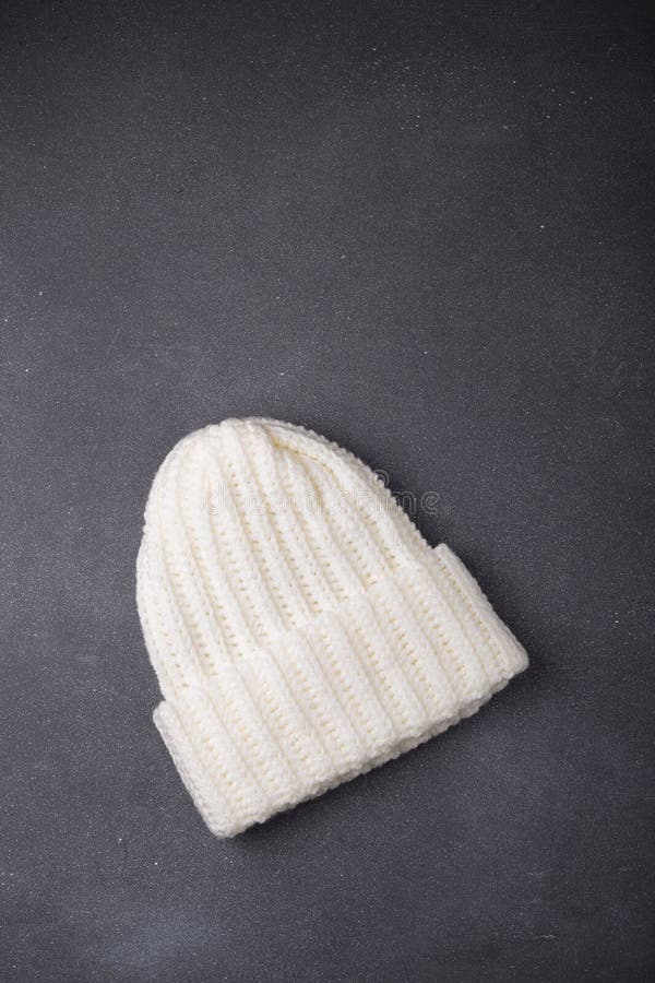 White Woolen Knitted Beanie Cap or Hat on Grey Background, Flat Lay Top ...
