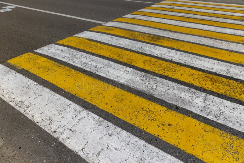 White and Yellow Pedestrian Crossing on the Road Stock Photo - Image of ...