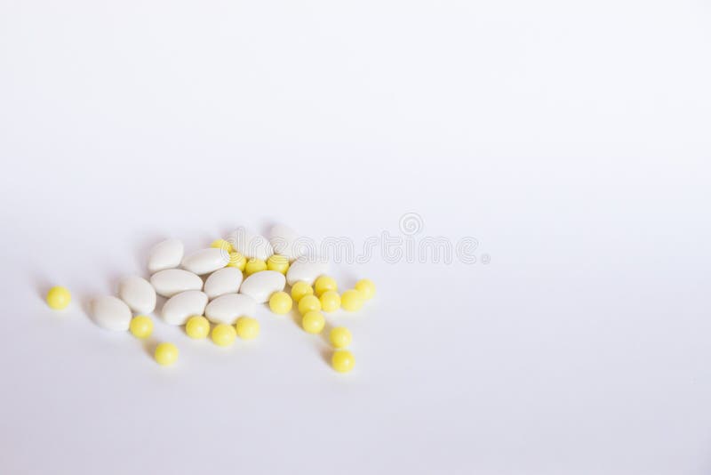 White and yellow tablets stock photo. Image of medicines - 177611062