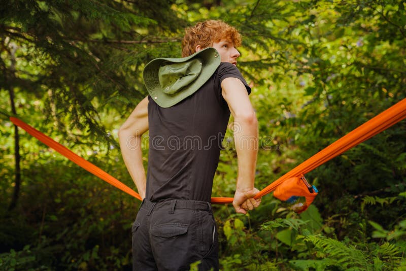 Young Man Resting in Hammock while Hiking in Green Forest Stock Image ...