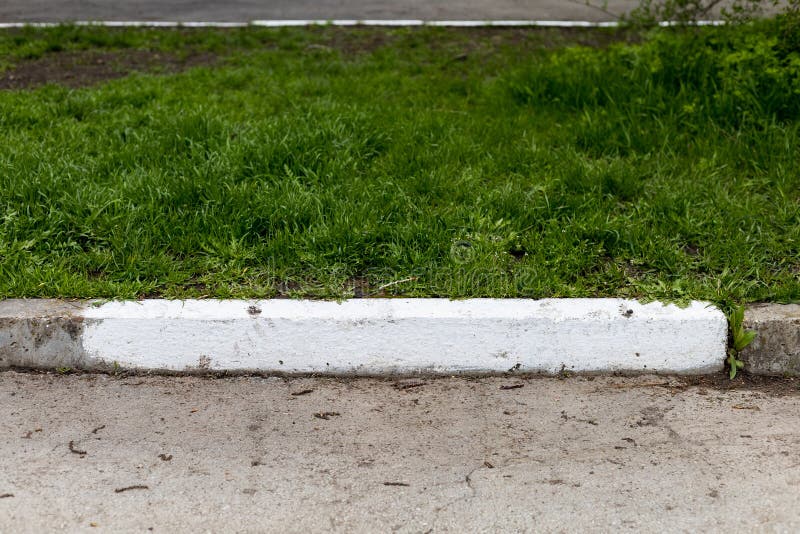 Whitewashed or Painted White Curb. Background in Urban Environment ...