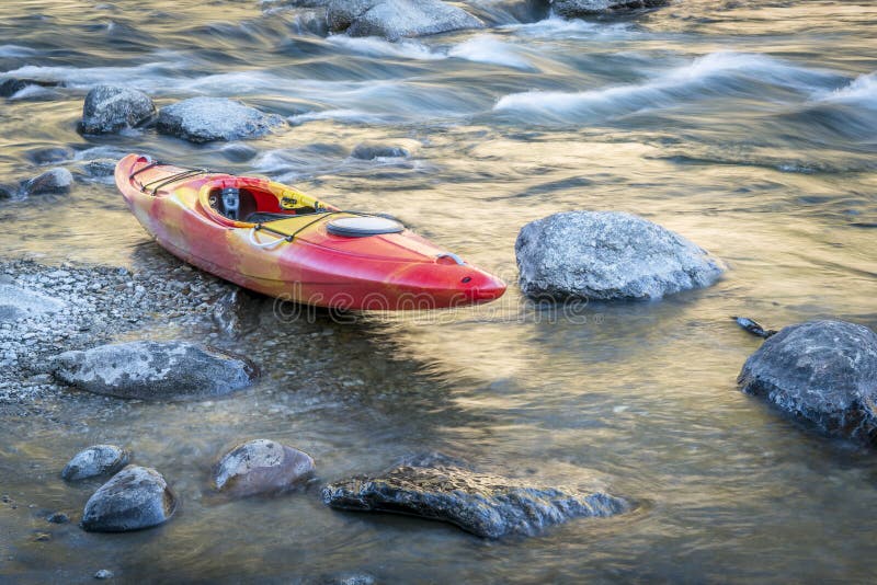 Whitewater Kayak on a River Shore with a Rapid Stock Photo - Image of ...