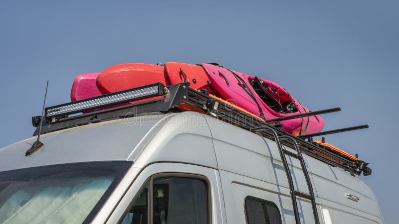 Whitewater Kayaks on Roof Racks of a Camper Van Stock Photo - Image of ...