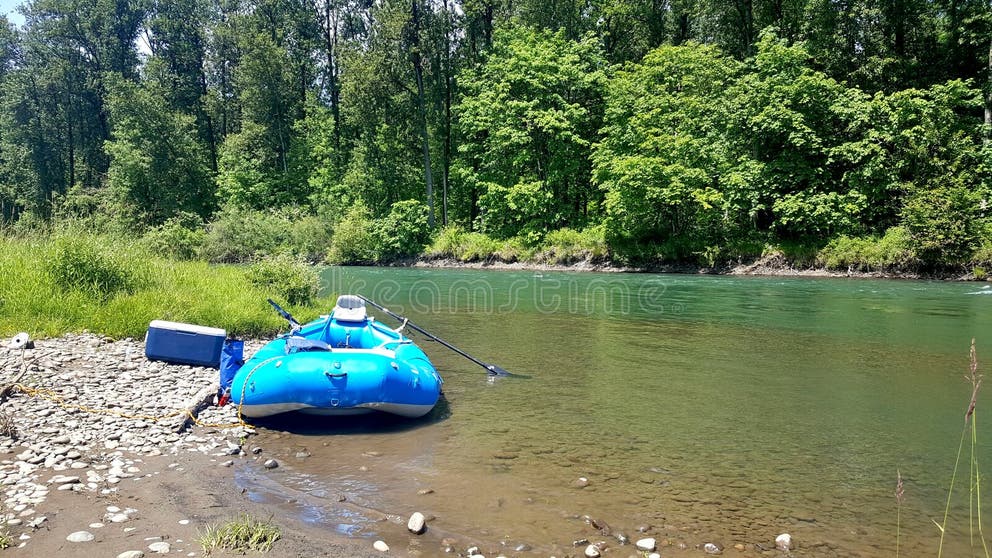 Blue raft pulled ashore stock image. Image of outdoor - 128208755