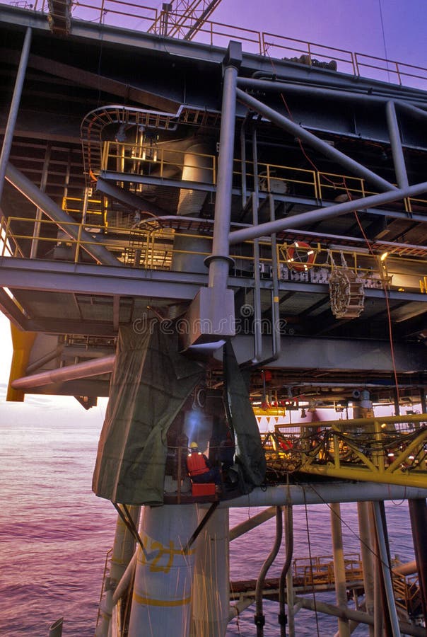 Whiting Platform Installation at Sunset with Welder at Work. Stock ...