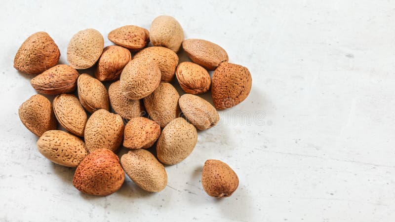 Whole Almonds in Shell, on White Board Stock Photo - Image of macro ...