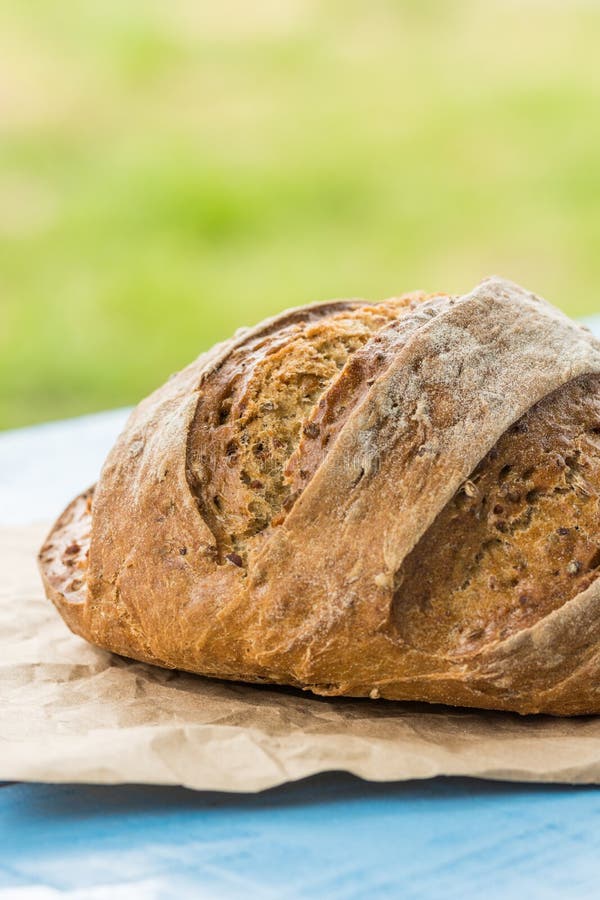 Bread In The Old Wrinkled Hands Of The Grandmother Close-up. Grandmas ...
