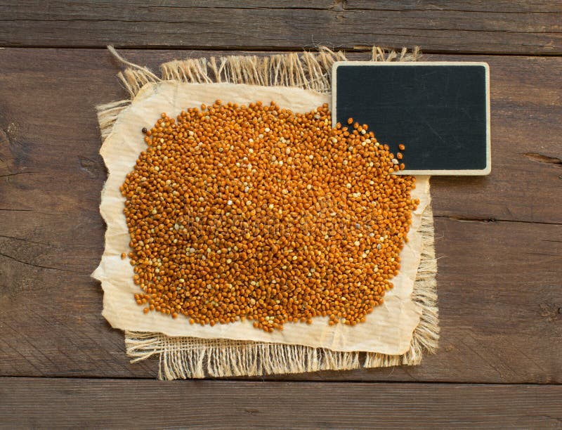 Whole Brown Millet Pile with a Small Chalkboard Stock Photo - Image of ...