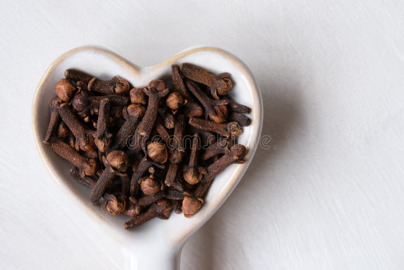 Whole Cloves on a Heart Shape Stock Image - Image of heart, love: 261158303