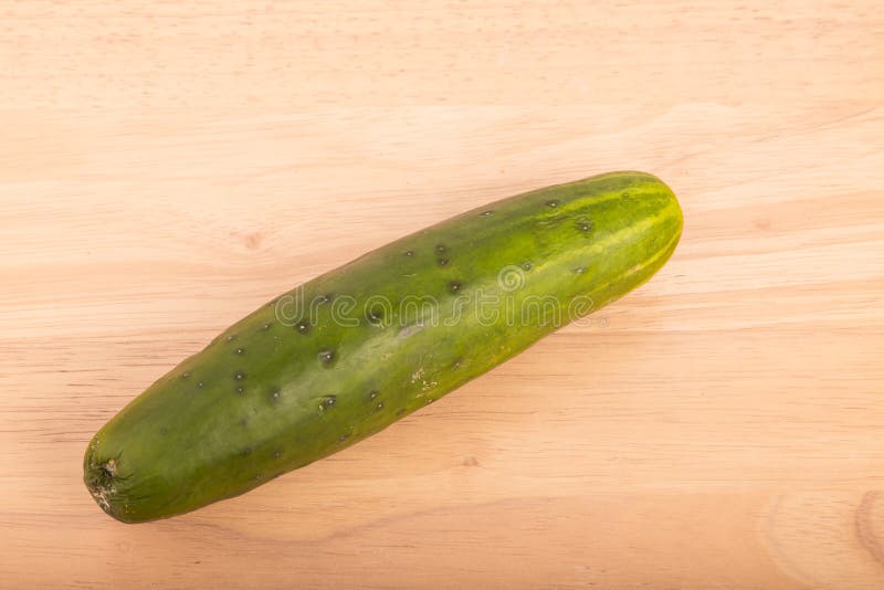 Whole Cucumber on Wood Table Stock Photo - Image of vegetable, healthy ...