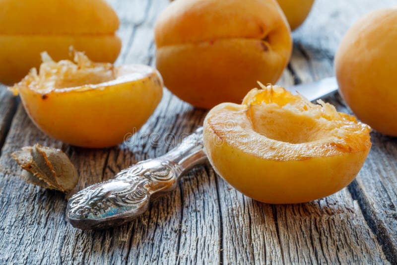 Whole and Cut Apricots on a Wooden Platter Stock Image - Image of ...