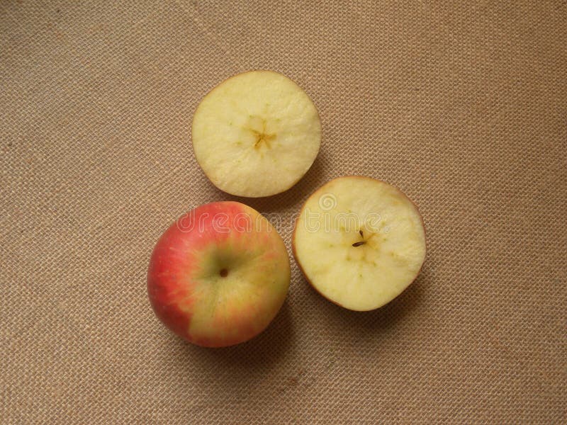 Whole and cut Fuji apple stock image. Image of chopped - 190007933