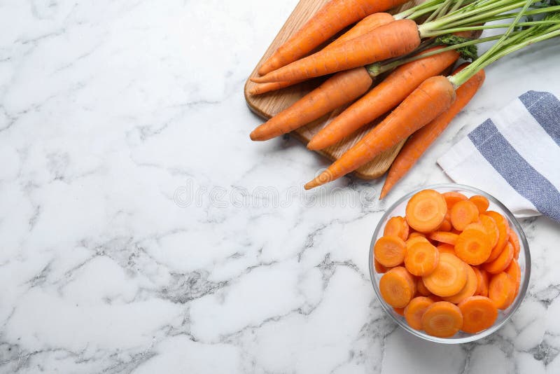 Whole and Cut Ripe Carrots on White Marble Table, Flat Lay. Stock Image ...