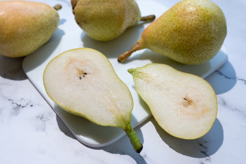 Whole and Cut Ripe Pears Scattered on the Table Stock Photo - Image of ...
