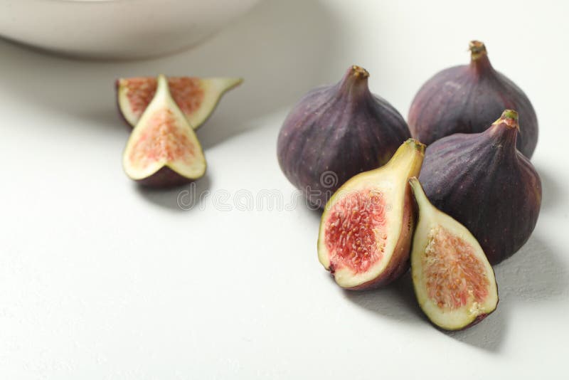 Whole and Cut Tasty Fresh Figs on White Table Stock Image - Image of ...