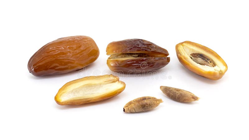 Whole Dates, Halved Dates and Date Pits on White Isolated Background ...