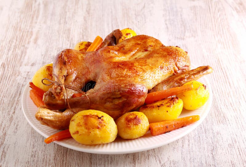 Whole Duck with Potatoes and Carrot Stock Photo - Image of spicy, meat ...
