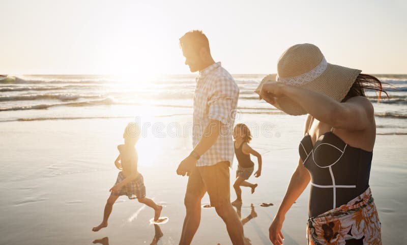 The Whole Family is Out for Some Beach Time. a Family of Four Spending ...