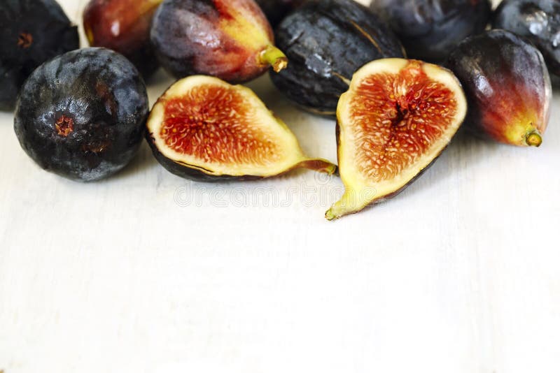Whole Figs and One Fig Sliced in Half. Selective Focus Stock Photo ...