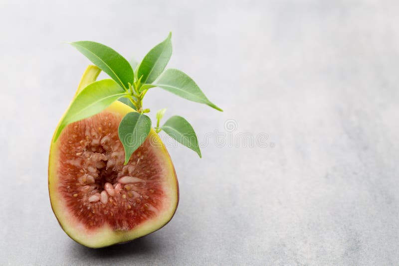 Whole Figs and One Fig Sliced in Half on Top of a Gray Table. Stock ...
