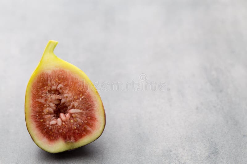Whole Figs and One Fig Sliced in Half on Top of a Gray Table. Stock ...