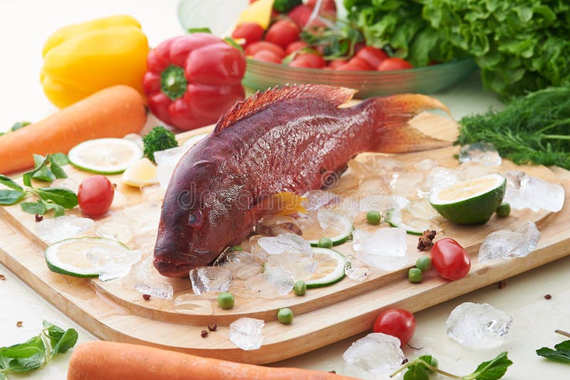 Whole fish stock photo. Image of lettuce, lime, vegetables - 51868452
