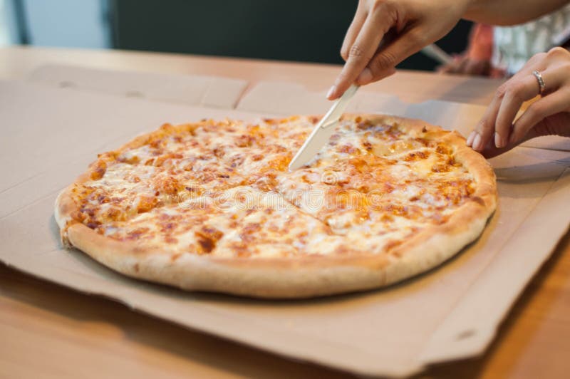 A Whole Four Cheese Pizza on a Dining Table Stock Photo - Image of ...