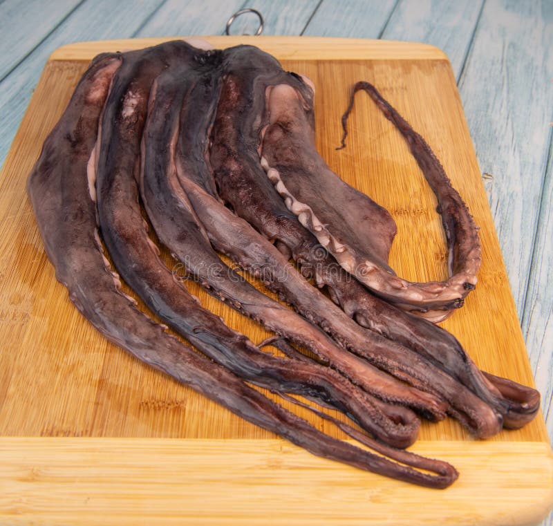 Whole Fresh Raw Octopus on Cutting Board Stock Photo - Image of board ...