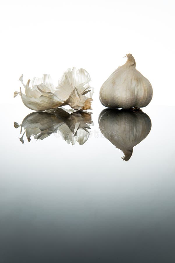 Whole Garlic with Garlic Skin and Reflections Stock Photo - Image of ...