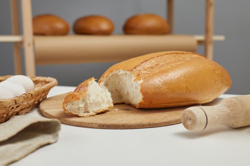 Whole Grain Bread on Bakery Kitchen Table with Fresh Baked Pastry on ...