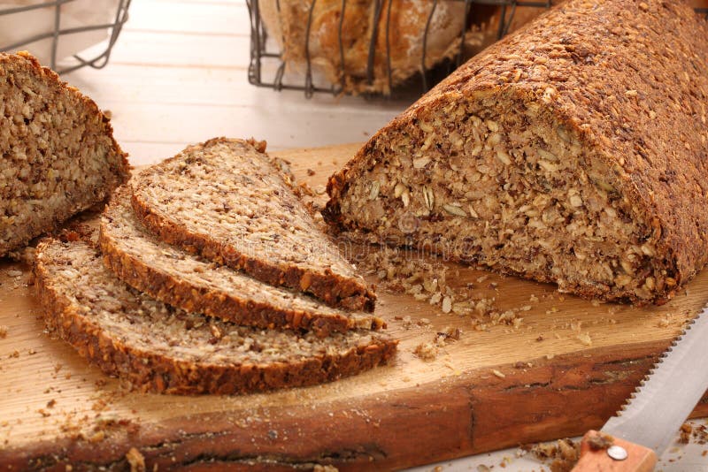 Whole Grain Bread on a Wooden Board Stock Image - Image of crust ...