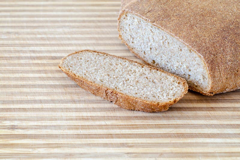 Whole Grain Round Bread on a Wooden Surface Stock Photo - Image of ...