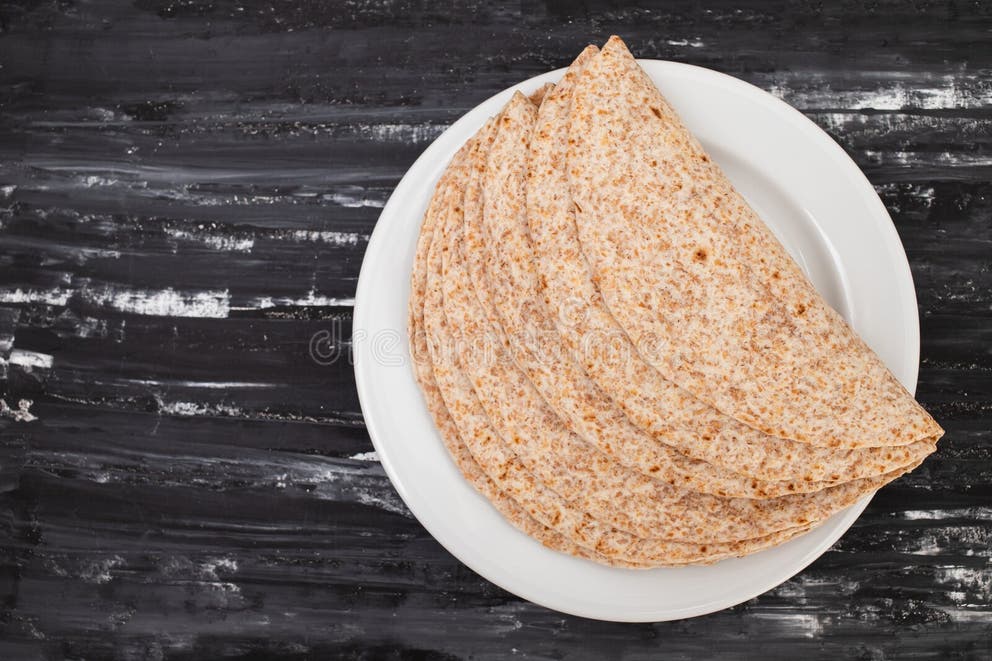 Whole Grain Tortilla Wraps on White Plate Stock Image - Image of ...