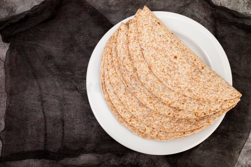 Whole Grain Tortilla Wraps on White Plate Stock Photo - Image of food ...