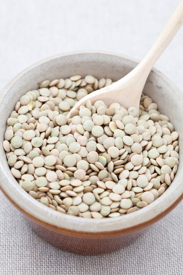 Whole green lentils stock image. Image of uncooked, utensil - 11831145