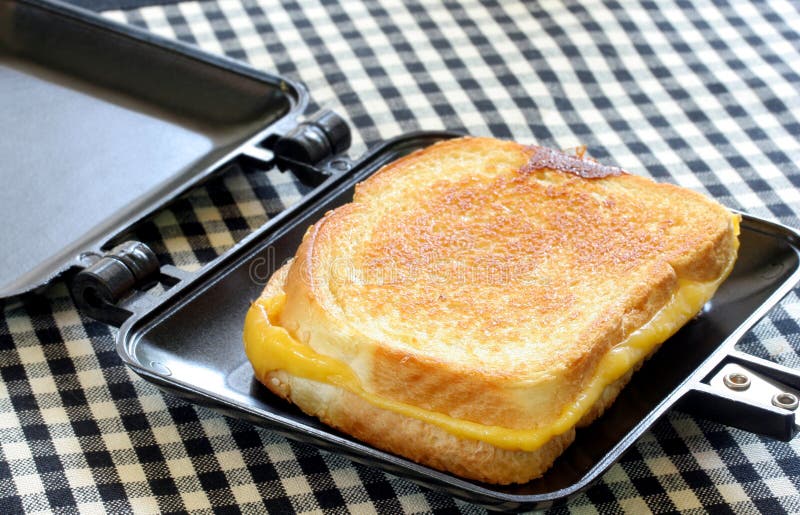 Whole Grilled Cheese in Sandwich Maker Stock Photo - Image of slice ...