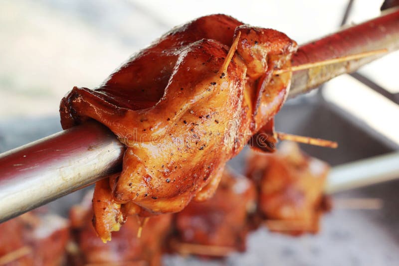 Whole Grilled Chicken on a Grill with Rotating Steel Plug. Stock Photo ...