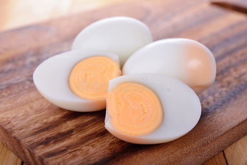Whole and Haft Cut Boiled Eggs without Shell on Wooden Board Stock ...
