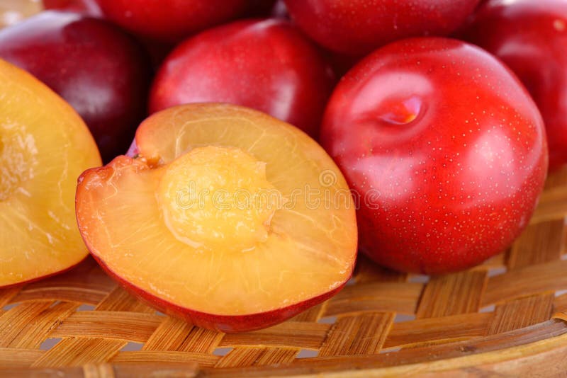 Whole and Half Cut Fresh Gulf Ruby Plum in Bamboo Basket Stock Image ...