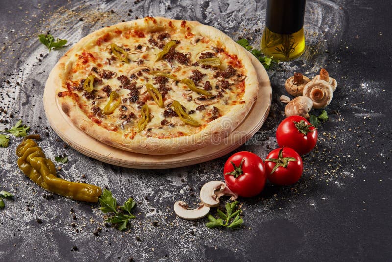 Whole Italian Pizza on Wood Table with Ingredients Stock Photo - Image ...