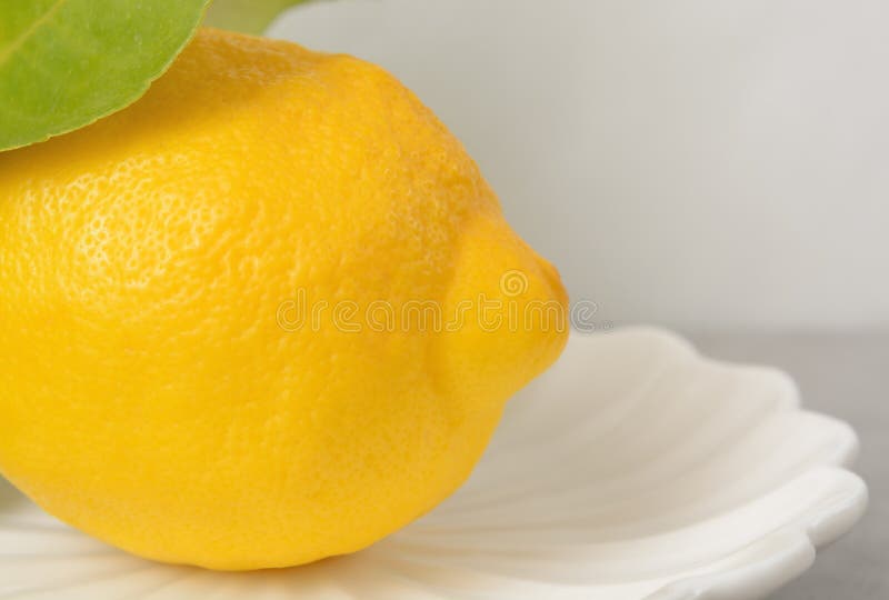 Whole Lemon on a Light Plate Stock Photo - Image of lemon, antioxidant ...