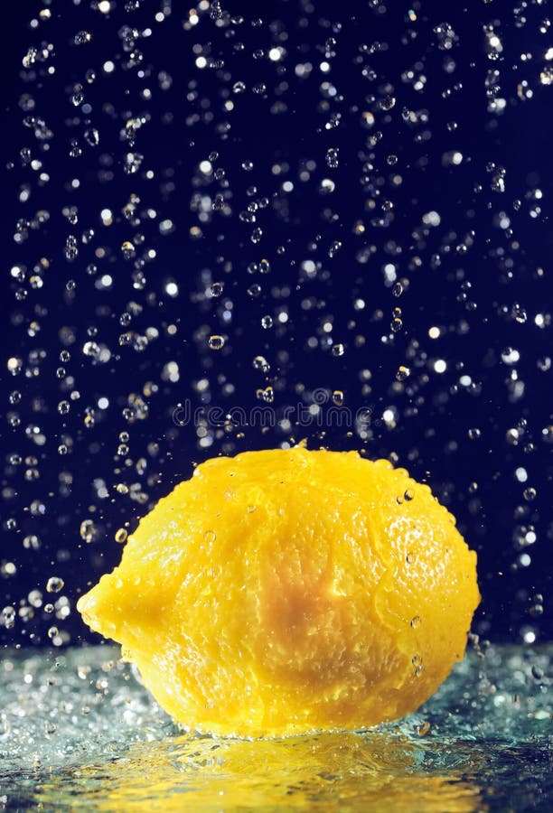 Whole Lemon with Stopped Motion Water Stock Photo - Image of floating ...