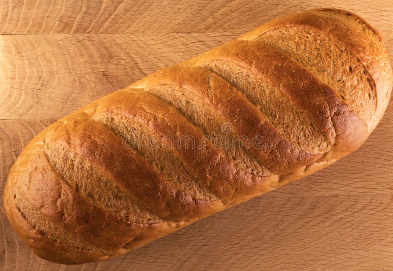 A Whole Loaf of Bread on a Wooden Board, View from the Top Stock Image ...